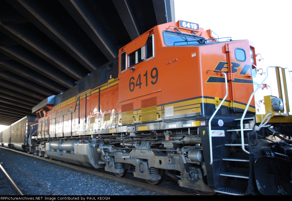 BNSF 6419 waits to head east as a rear DPU on a loaded coal train.